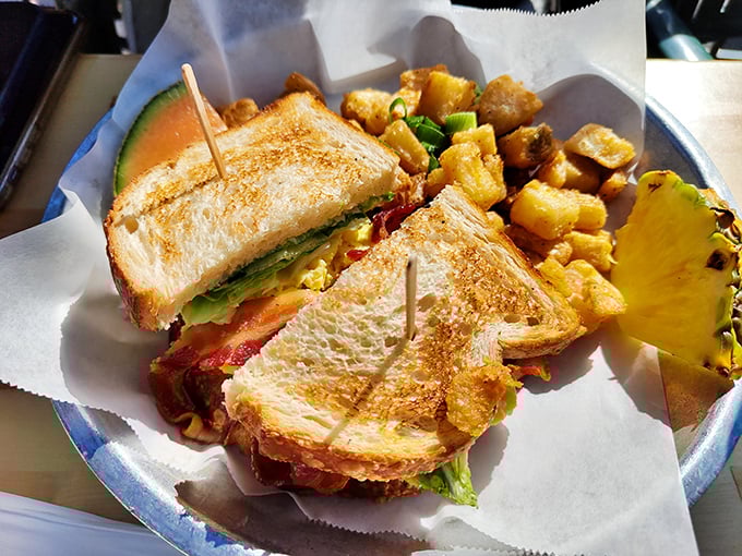 This sandwich isn't just stacked&mdash;it's architecturally sound. Fresh ingredients between perfectly toasted bread, with home fries that deserve their own Instagram account.