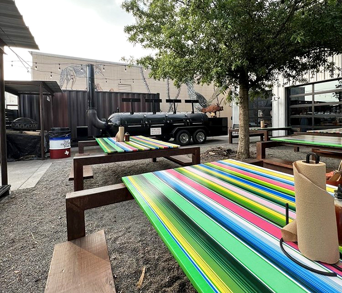 Colorful serape-inspired tablecloths brighten the outdoor dining area, where you can watch smoke billowing from the massive smokers.