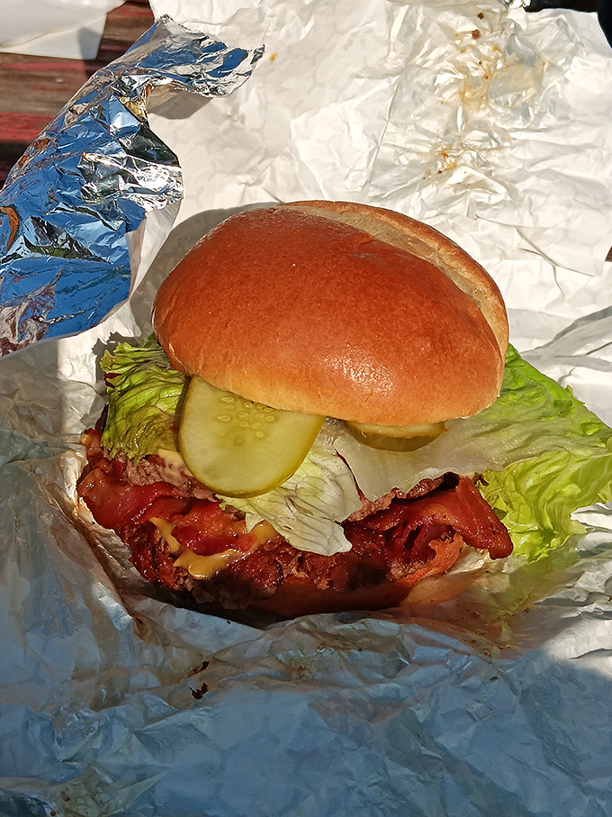 A burger that demands to be noticed, with bacon standing proud like it's accepting an award for Best Supporting Ingredient.