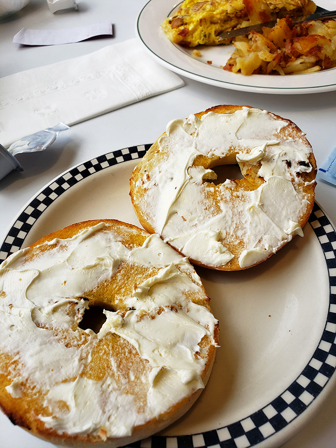 Bagels slathered with cream cheese so generously you'd think they were applying sunscreen to a very pale child at the beach.