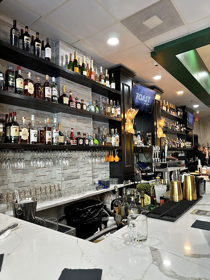 The bar at Toast on Lenox isn't just stocked&mdash;it's curated, with bottles lined up like soldiers ready to enhance your brunch battle plan.
