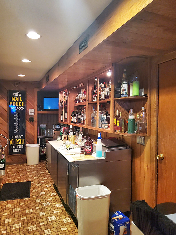 A bar stocked with everything needed to wash down a perfect steak. That vintage Mail Pouch sign adds just the right touch of nostalgia.