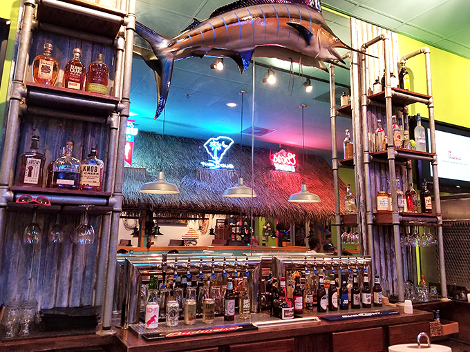 Marlin-watching while you sip! The impressive fish mounted above this well-stocked bar adds authentic coastal charm to your dining experience.