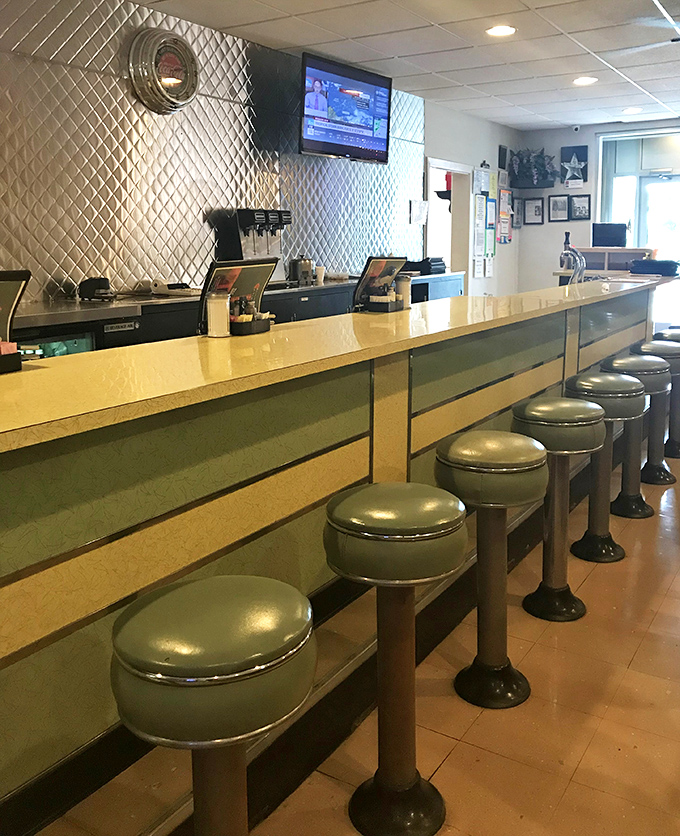The counter where regulars have worn their own subtle impressions into the seats, a diner's version of the Hollywood Walk of Fame.