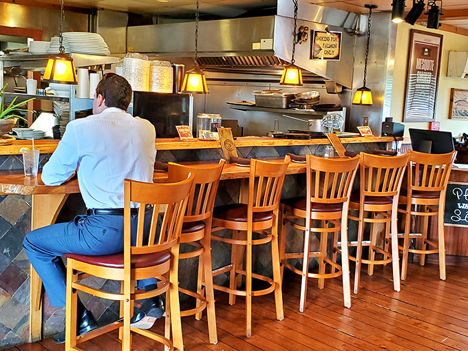 Bar seating: where solo diners become culinary voyeurs, watching kitchen magic unfold while sipping something wonderful.