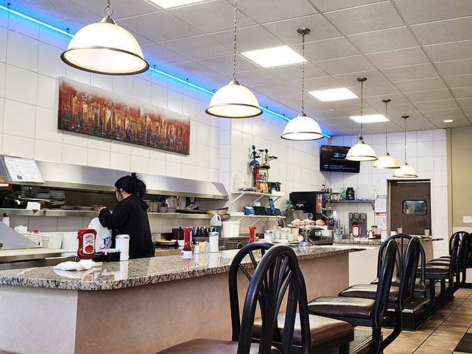 Where the magic happens &ndash; the counter seating offers a front-row view to the choreographed chaos of short-order cooking.