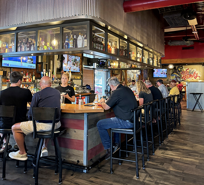 The bar where strangers become friends over shared stories and perfectly poured drinks. Notice how everyone's leaning in&mdash;that's the gravity of good conversation.
