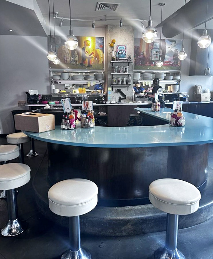 The counter seating offers front-row tickets to the culinary show. Those globe lights cast the perfect glow for food photography.