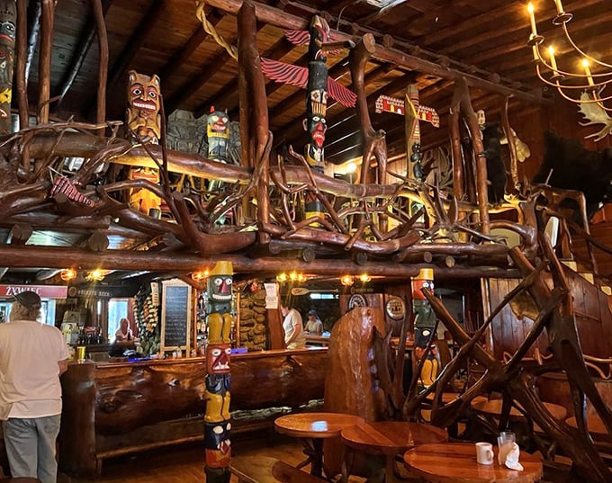Handcrafted wooden beams and Native American-inspired carvings create a bar area that feels like stepping into a fantastical forest lodge where stories flow as freely as the drinks.