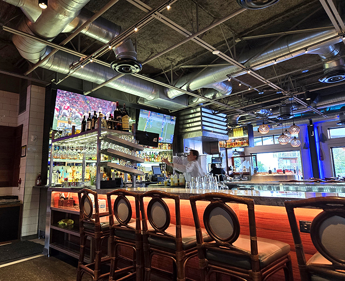 The bar glows with amber promise, where skilled mixologists craft cocktails worthy of pairing with the ocean's finest offerings.