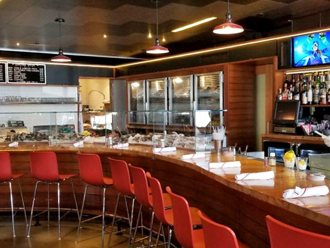 The bar area&mdash;where oyster dreams come true and cocktails are crafted with the same precision as the seafood they accompany.