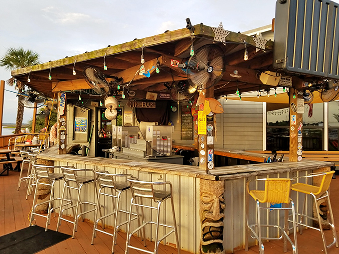 Tiki vibes meet nautical necessities at this outdoor bar, where ceiling fans cool conversations that flow as easily as the drinks being poured.
