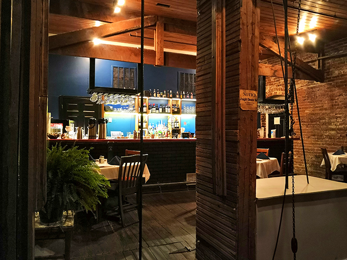 The bar area gleams with promise as evening approaches, like a stage set for the night's performance of cocktails, conversations, and culinary delight.