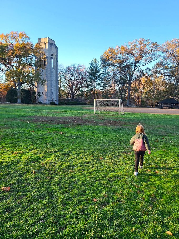 The bell tower watches over impromptu soccer matches and sunset strolls, a silent guardian of Mariemont's idyllic green spaces.
