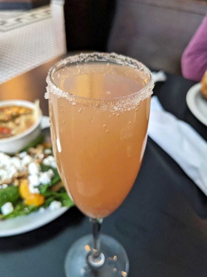 Bubbles and blush-tinted promise in a sugar-rimmed glass. This mocktail proves designated drivers deserve deliciousness too.