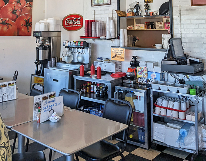 The beverage station—where coffee flows like conversation and the Coca-Cola sign reminds you that some brands are eternal, just like diners.