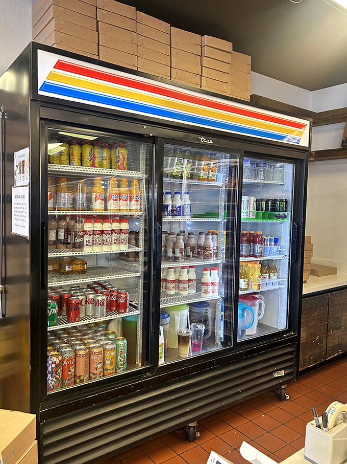 The beverage cooler stands ready – because proper donut appreciation requires hydration. It's practically a health requirement.