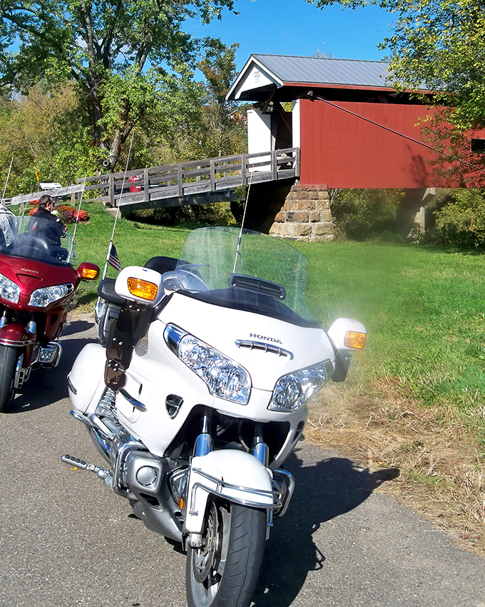 Motorcycle enthusiasts know the best roads lead to hidden treasures&mdash;this covered bridge makes a perfect pit stop on a sunny afternoon ride.