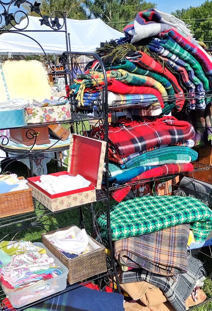 Woolen treasures stacked high&mdash;these aren't just blankets but time machines to cabin weekends and fireside evenings of yesteryear.