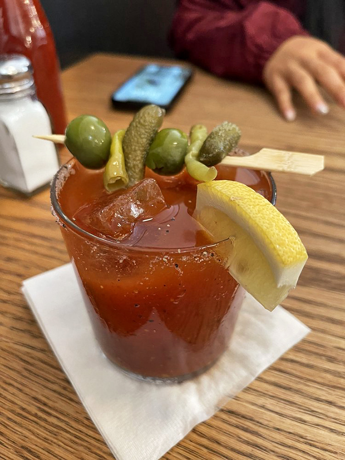 A Bloody Mary garnished like a pickle parade float &ndash; because sometimes breakfast needs a little liquid courage and vegetable therapy.