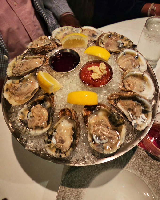 These Blue Point oysters arrive like celebrities on ice, complete with condiment entourage and lemon wedge paparazzi.