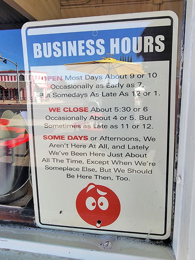 The most honest business hours sign in America. Translation: "We're here when we're here, and the burgers are worth the gamble."