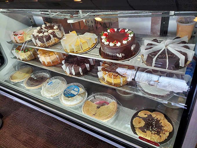 The dessert case: where willpower goes to die and "I'll just have a bite" becomes the lie we tell ourselves.