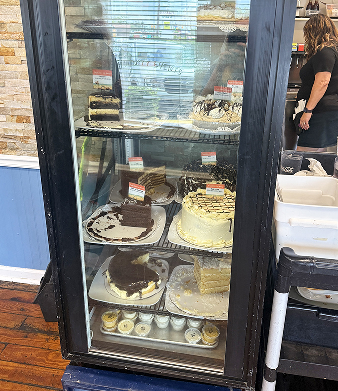 The cake display that turns "I shouldn't" into "I'll have a slice" faster than you can say "diet starts tomorrow."