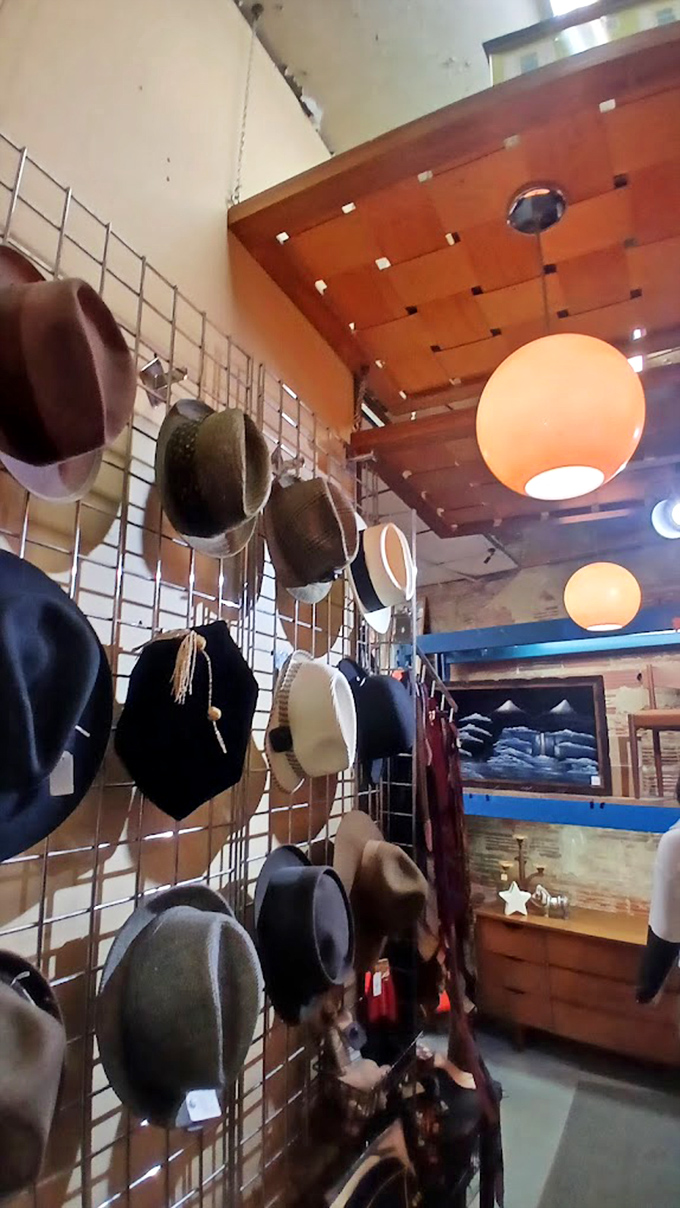 Hat heaven for the stylishly nostalgic. That wall isn't just displaying headwear&mdash;it's showcasing personality types from beatnik to businessman.