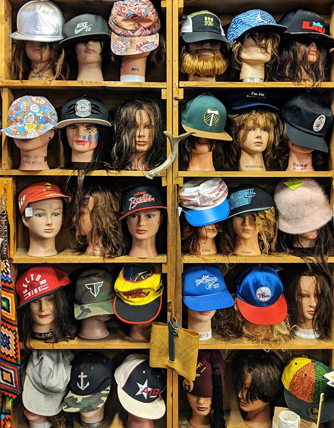 The wig and hat section: where mannequin heads model everything from Timbers caps to hairstyles that defined decades past.