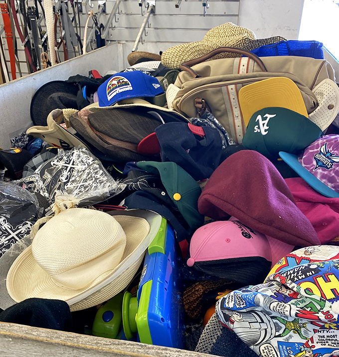 Hats piled like a milliner's fever dream, from baseball caps to sun hats for every occasion.