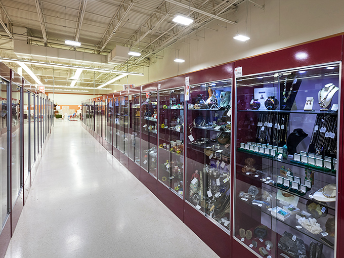 The jewelry cases stretch like a glittering runway of history. Each piece whispering tales of special occasions from another era.