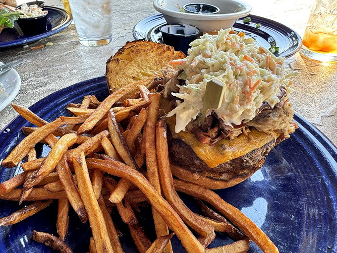 This isn't just a sandwich&mdash;it's a towering achievement of culinary engineering with hand-cut fries standing guard alongside.