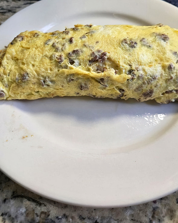 This omelet doesn't just contain cheese and meat&mdash;it enfolds them in a fluffy yellow embrace that makes you forget all other breakfast options.