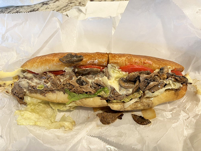 Thinly sliced beef, melted cheese, and fresh vegetables create a cheesesteak that would make Philadelphians question their loyalty to their hometown heroes.