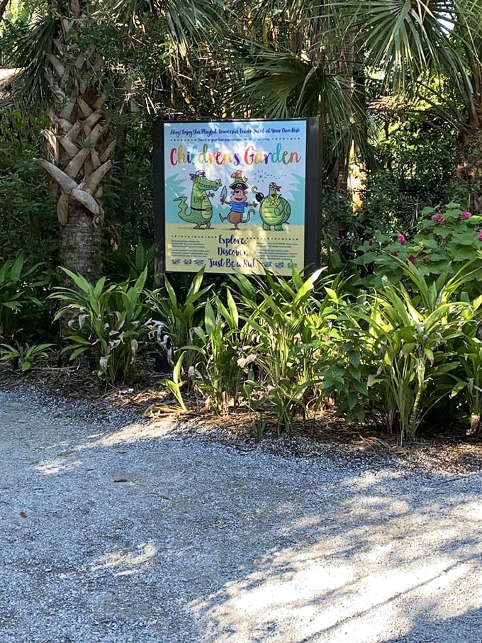 The Children's Garden sign promises adventures for the young and young-at-heart. Dinosaurs included, parental imagination required.