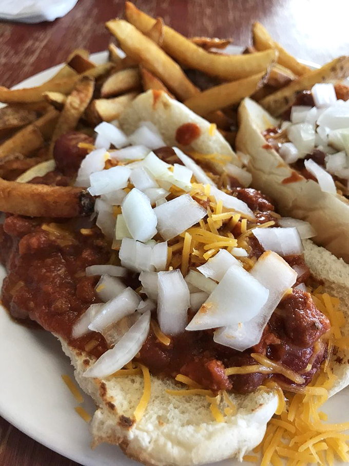 Chili cheese dog architecture that defies gravity and good sense&mdash;a beautiful mess that requires strategy, napkins, and absolutely zero regrets.
