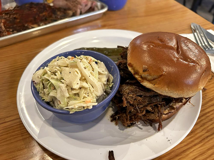 The pulled pork sandwich&mdash;where slow-smoked porcine perfection meets pillowy bun in a relationship your taste buds will want to third-wheel.