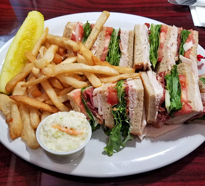 The club sandwich&mdash;architecture's greatest contribution to lunchtime, where each perfectly stacked layer deserves its own round of applause.