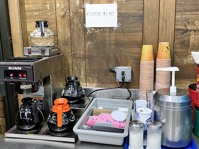 The coffee station: humble, utilitarian, and essential as sunrise. No barista theatrics here&mdash;just honest brew for honest people with donut dreams.