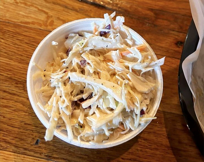 Coleslaw that knows its purpose in life: to cut through rich barbecue with crisp, tangy perfection. Not just a side&mdash;it's an essential companion.