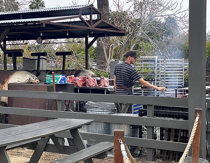 Where the magic happens. The pitmaster tends his craft with the focus of a surgeon and the patience of a saint.