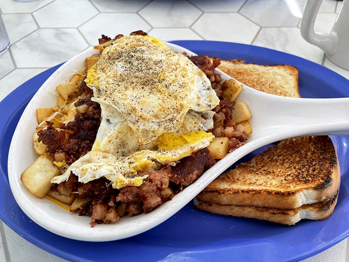 Corned beef hash crowned with a sunny-side sentinel. This hearty skillet doesn't just feed your body—it fortifies your soul against whatever the day might throw at you.