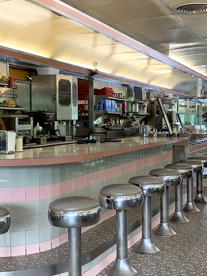 The counter's pink and white tile work isn't retro by design&mdash;it's authentic by survival, a testament to enduring quality over passing trends.