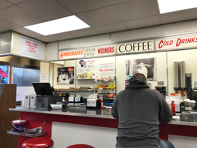Where "WEINERS" and "COFFEE" share equal billing on the marquee, a reminder that in America's diners, all comfort foods deserve spotlight.