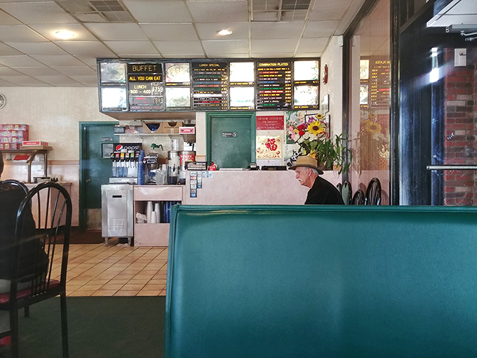 Where the magic begins: the counter area showcases lucky cats watching over diners making impossible choices.