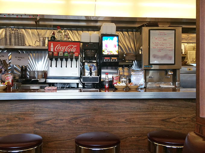 Behind the counter, where the magic happens. The soda fountain and coffee station stand ready for the next round of refills.