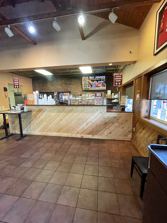 The ordering counter&mdash;where dreams are placed and smoky realities are born. Wood paneling that's witnessed thousands of "mmm" moments. 