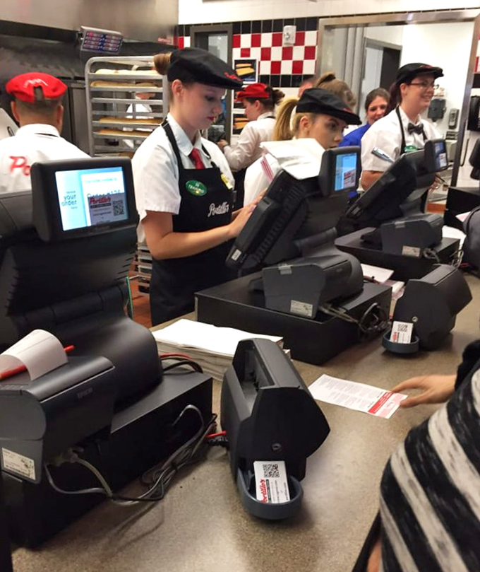 The ordering counter buzzes with anticipation as customers prepare for their next culinary adventure.