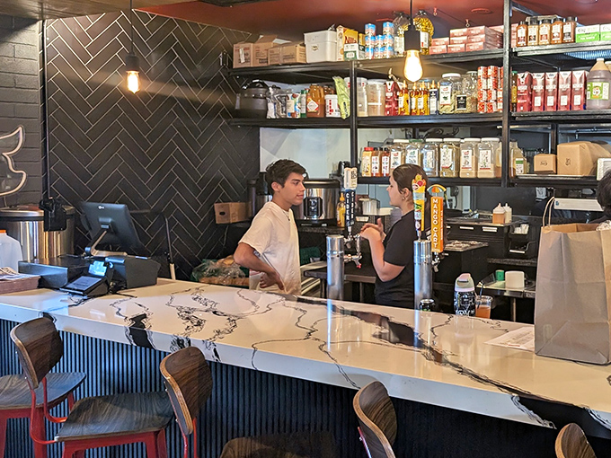 At the counter, culinary magic happens in plain sight&mdash;where friendly staff transform orders into edible works of art with practiced efficiency.